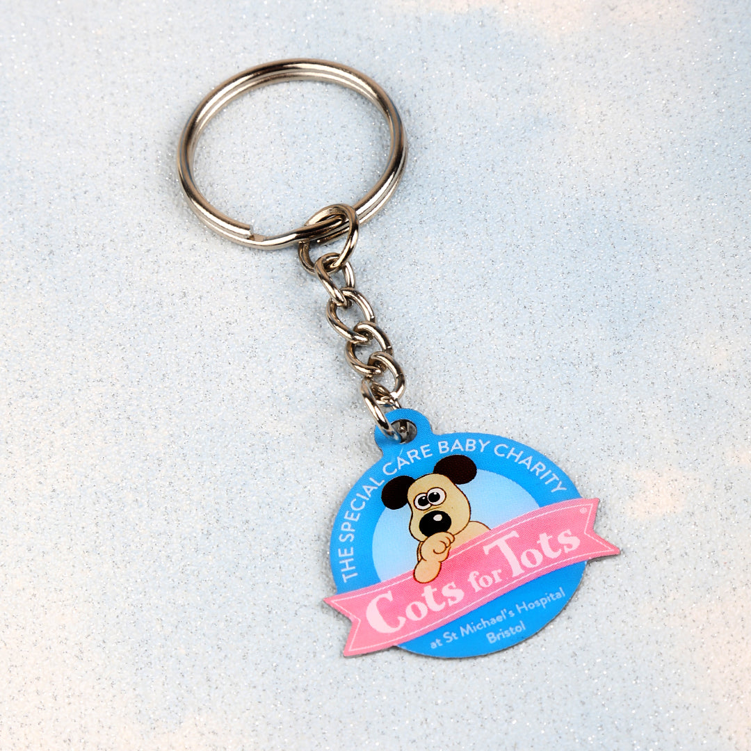 Cots for Tots Logo Keyring – Gromit Unleashed Shop